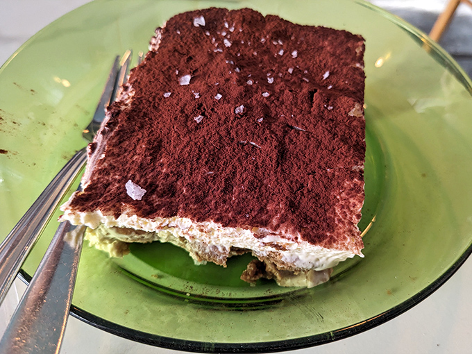 Tiramisu that doesn't mess around. The cocoa-to-cream ratio suggests someone in the kitchen understands the importance of balance in desserts.