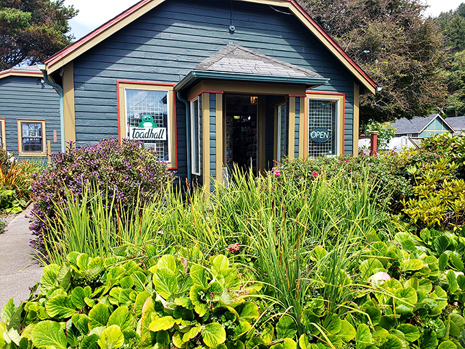 Toad Hall stands as a testament to Yachats' commitment to locally-owned businesses, surrounded by coastal greenery that thrives in the misty air.