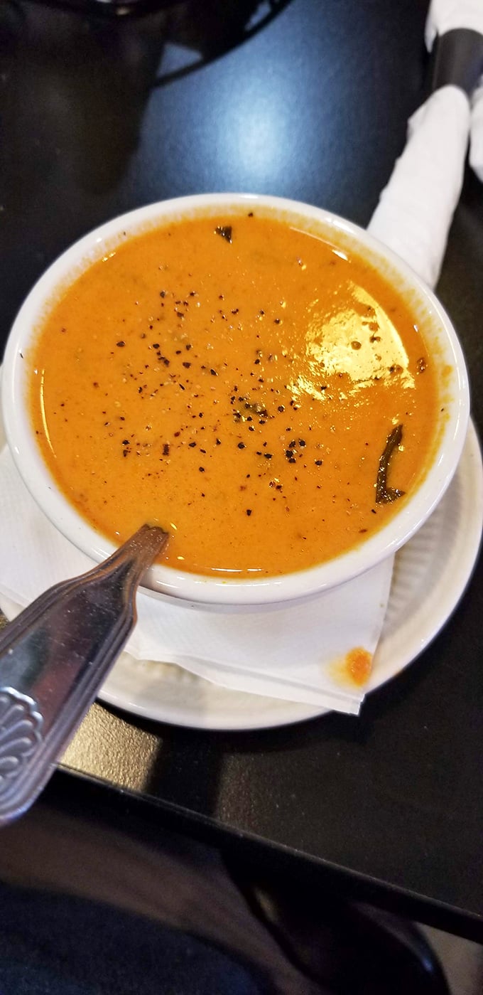 Tomato soup: the comfort food equivalent of a warm hug from your favorite aunt. This vibrant orange bowl practically whispers, "Everything's gonna be okay."