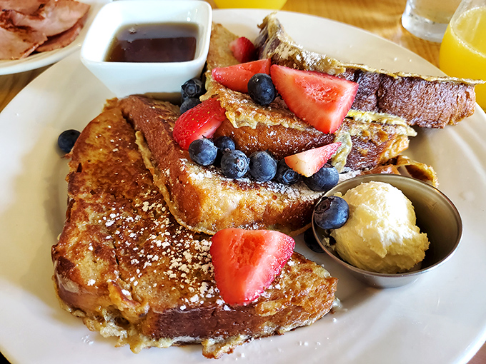 French toast that puts ordinary breakfast to shame&mdash;golden challah piled with berries and a scoop of butter melting seductively.