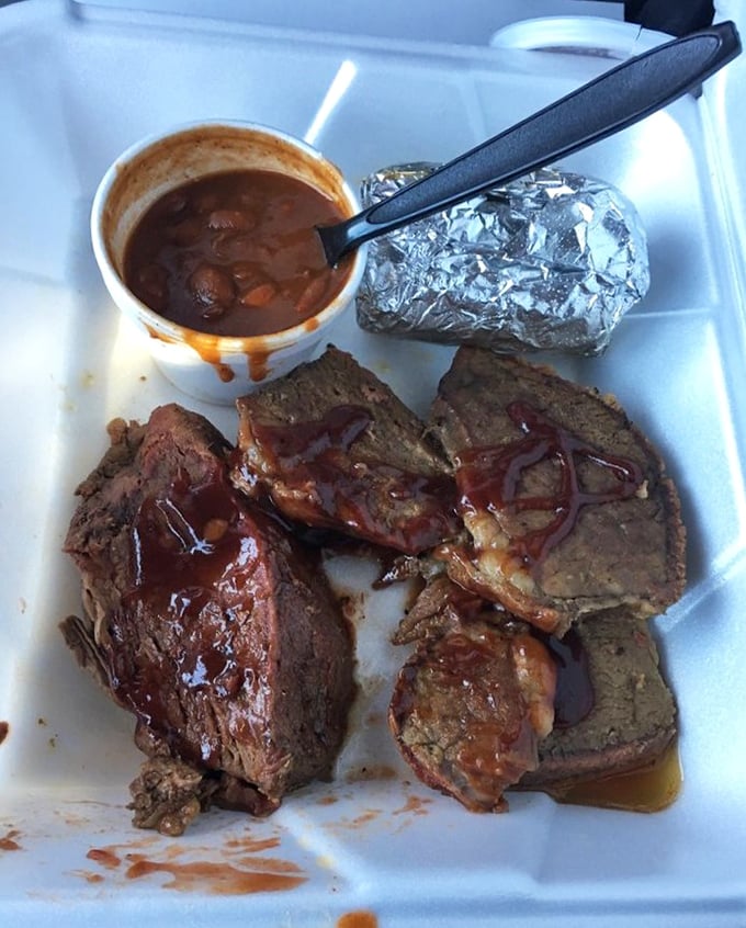 Tri-tip that's seen the business end of a smoker and lived to tell a delicious tale. That sauce cup isn't nearly big enough.