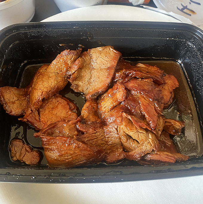 Tri-tip bathing in its own juices, glistening with a promise that makes vegetarians question their life choices.