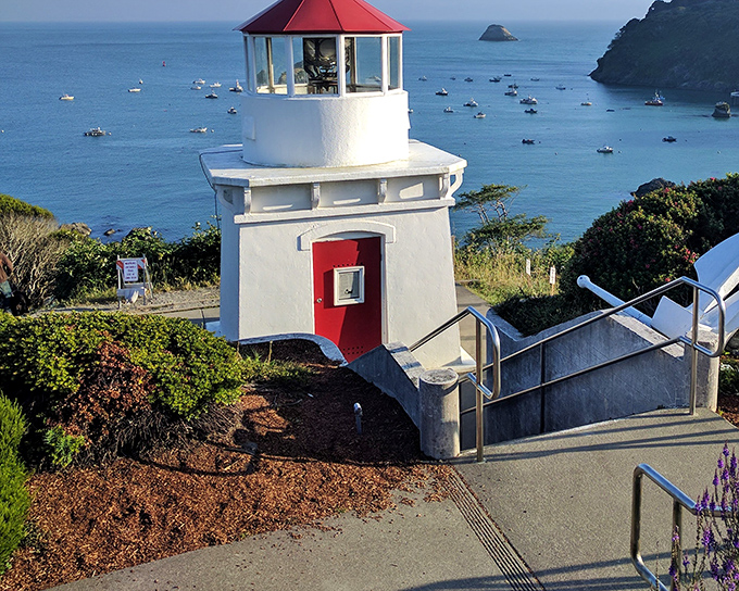 Trinidad's Memorial Lighthouse stands sentinel over the bay, its crisp white walls and cherry-red roof a beacon for both ships and camera-wielding visitors.