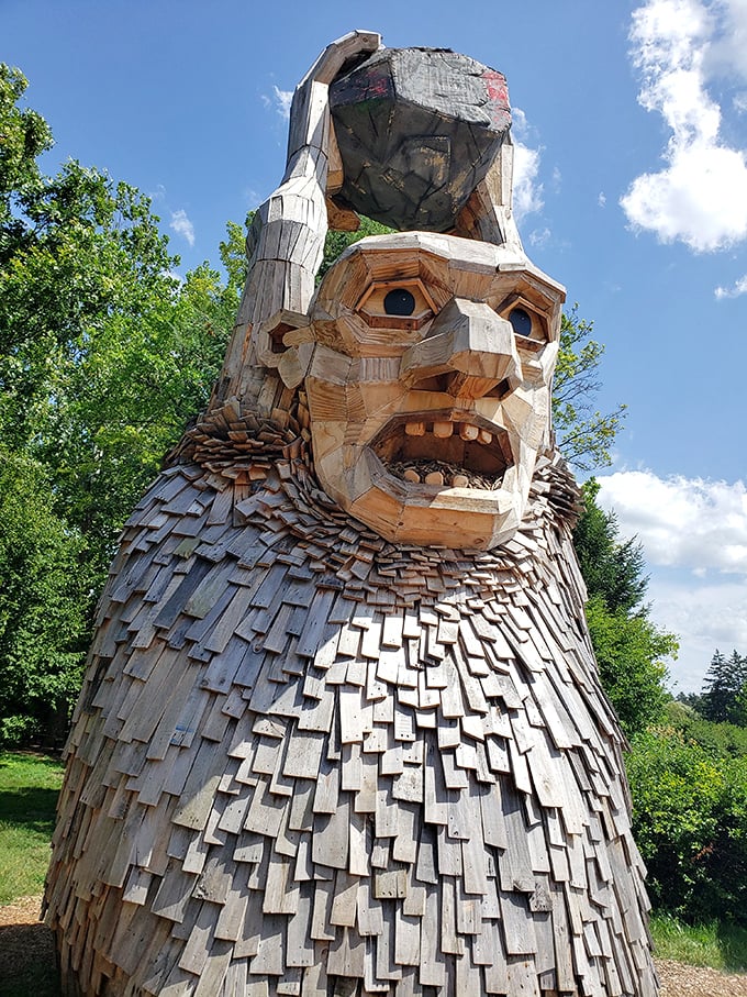 This wooden giant appears to be contemplating the meaning of life&mdash;or possibly wondering why humans keep taking selfies with him.