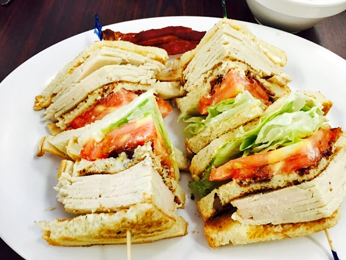 The club sandwich—that architectural marvel of bread, meat, and vegetables—executed with the precision of a breakfast joint that understands lunch isn't just an afterthought.