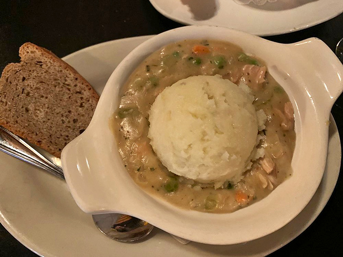 This cottage pie's mashed potato dome sits atop a savory stew like a cozy blanket, proving comfort food transcends all borders.
