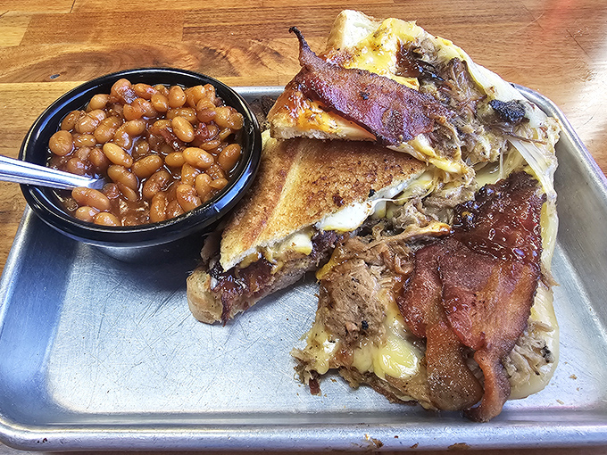 The Ultimate Grilled Cheese isn't messing around &ndash; layers of meat, cheese, and Texas toast that would make your cardiologist nervously clear their throat.