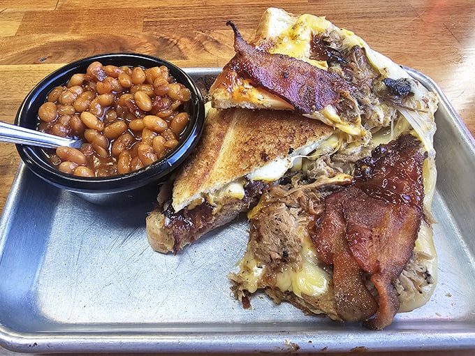 The Ultimate Grilled Cheese isn't messing around &ndash; layers of meat, cheese, and Texas toast that would make your cardiologist nervously clear their throat.