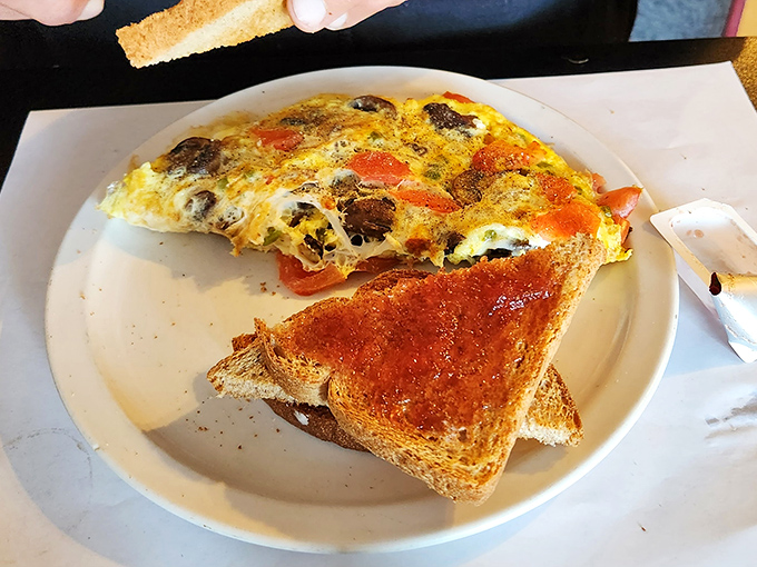 Vegetables in an omelet aren't just healthy&mdash;they're necessary architecture, creating pockets of flavor in this colorful breakfast masterpiece.