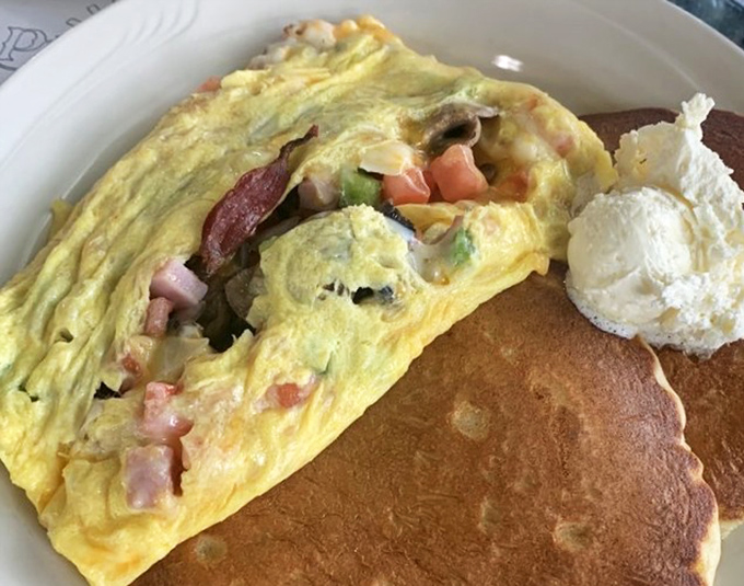 This isn't just an omelet&mdash;it's a vegetable apartment complex where peppers, ham, and cheese have moved in together and become best friends.