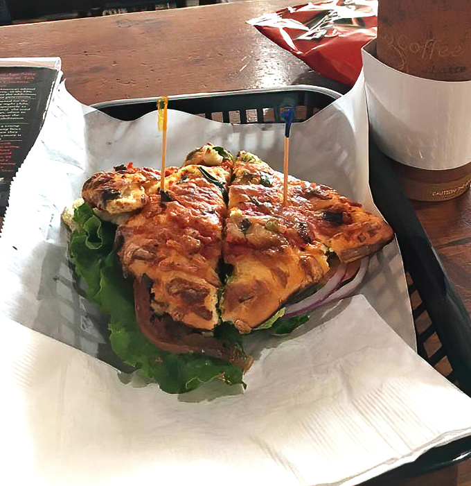 A sandwich that could convert carnivores—fresh greens and savory fillings nestled between hearty bread slices, proof that vegetables can be the main event.