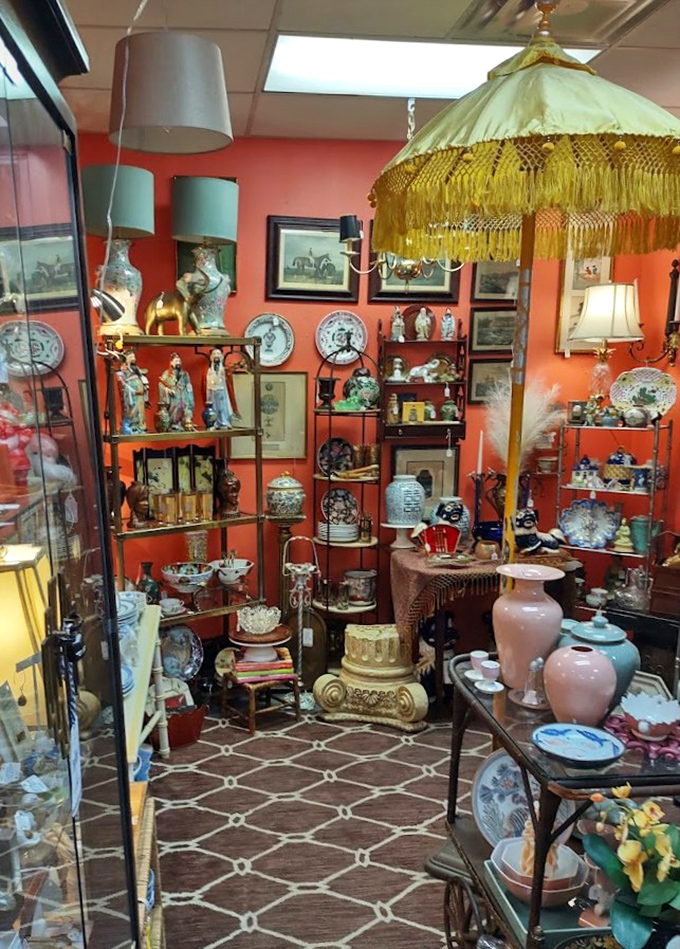 A coral-walled time capsule where porcelain figurines and gilded treasures create a tableau worthy of Downton Abbey's finest drawing room.