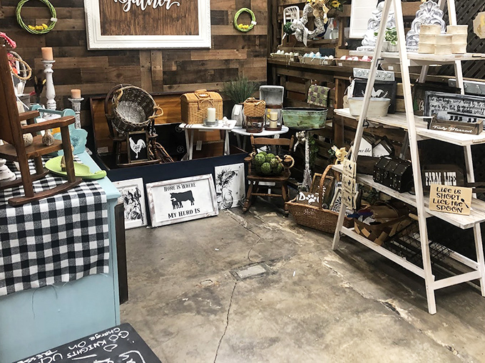 Farmhouse chic before Instagram knew it existed. This rustic display combines weathered wood and vintage signage for authentic country charm.