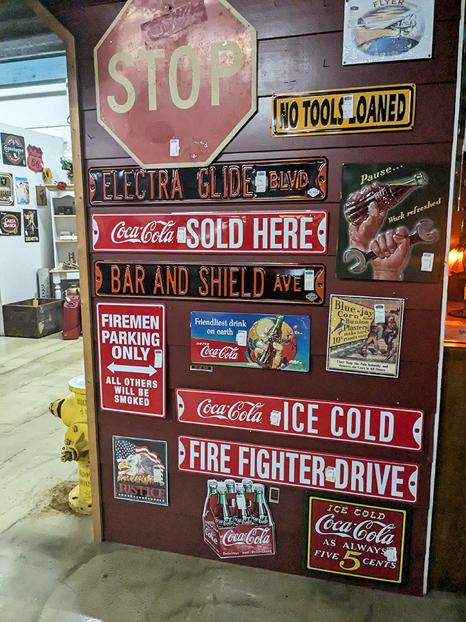 Wall of vintage signs that perfectly captures that moment when advertising was an art form and Coca-Cola was always five cents.