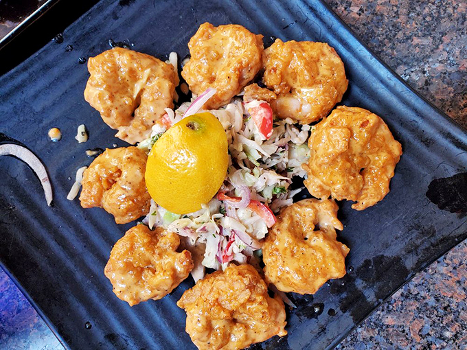 These golden-fried shrimp arranged like a sunburst aren't just food &ndash; they're edible art that happens to taste like heaven.