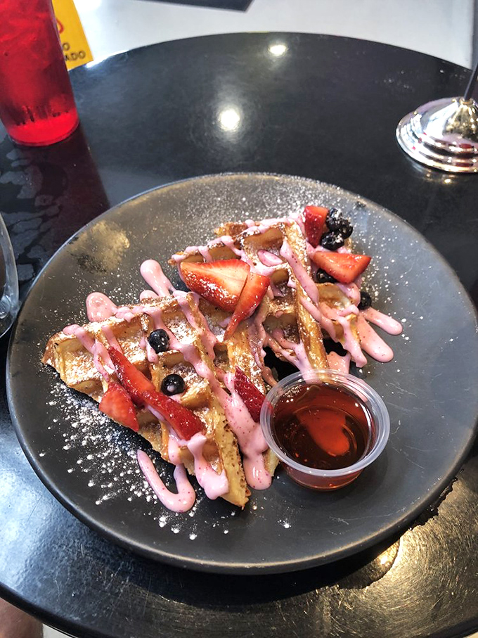 Waffles that dresses for the occasion&mdash;berry drizzle, fresh fruit, and a dusting of powdered sugar create breakfast worth getting out of bed for.