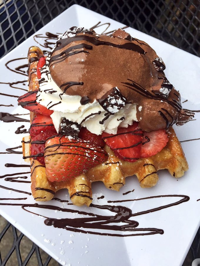 This isn't just a waffle&mdash;it's an architectural masterpiece of chocolate, strawberries, and whipped cream. Breakfast or edible art? Both.