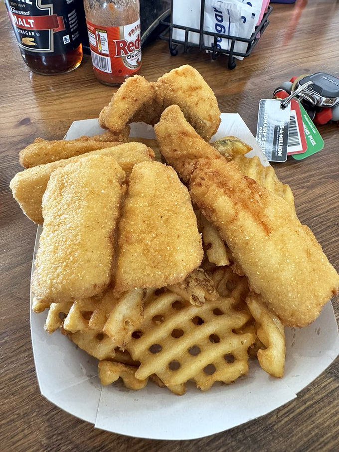 Waffle fries and walleye—a Great Lakes love story. This plate has more golden crunch than Fort Knox, and twice the satisfaction.