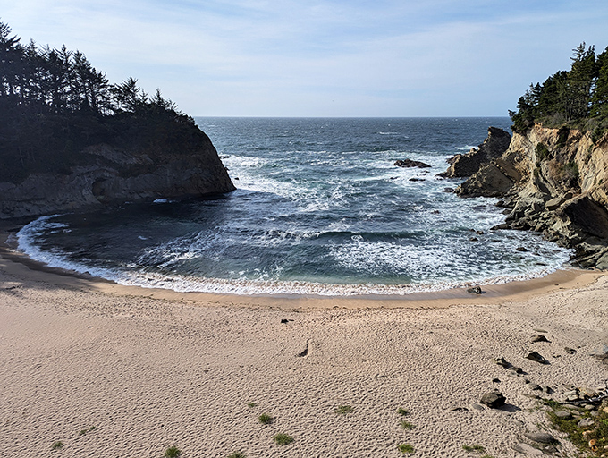 The perfect crescent of sand nestled between protective cliffs &ndash; nature's version of being hugged from both sides.
