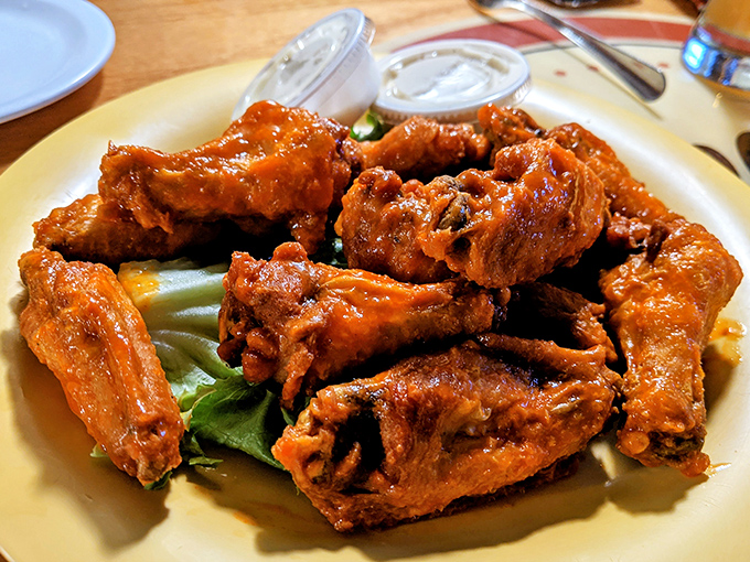 Wings so perfectly sauced they should come with a warning label: "May cause involuntary food noises that will embarrass your dining companions."