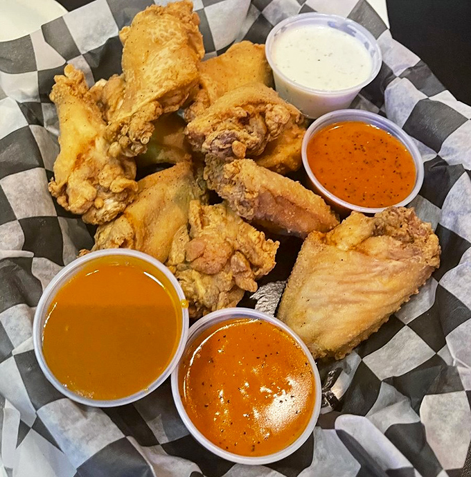 Wings that don't need a sporting event excuse&mdash;crispy, saucy perfection served with enough dipping options to keep you happily experimenting.