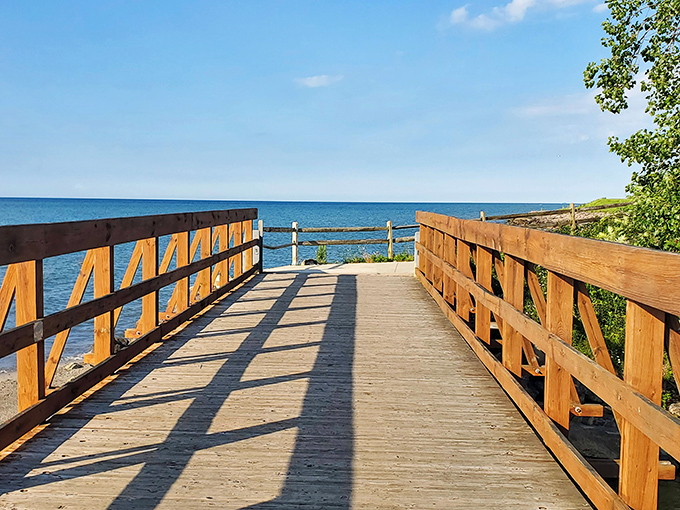 This wooden walkway practically whispers, "Follow me to something wonderful," and Lake Erie delivers on that promise with panoramic blue perfection.