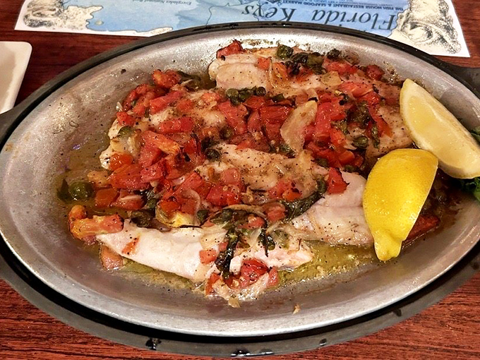 Yellowtail snapper gets the royal treatment, blanketed with fresh tomatoes and herbs that would make any fish feel honored to be on your plate.