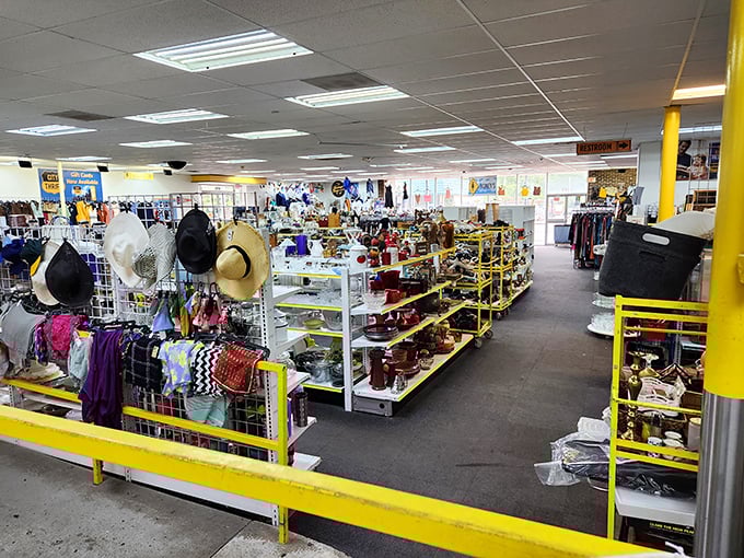A thrifter's panorama of possibility. The yellow shelving creates pathways through this bazaar of pre-loved treasures waiting for their second act.