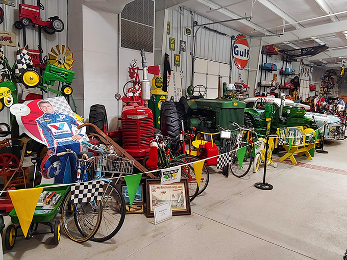 John Deere tractors sharing space with vintage bikes &ndash; it's like a mechanical family reunion in here.