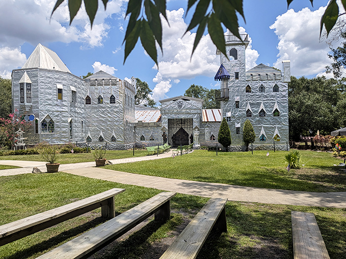 The castle's gleaming exterior catches clouds and sky in its rippled surface, creating a constantly changing canvas that would make even Camelot jealous.