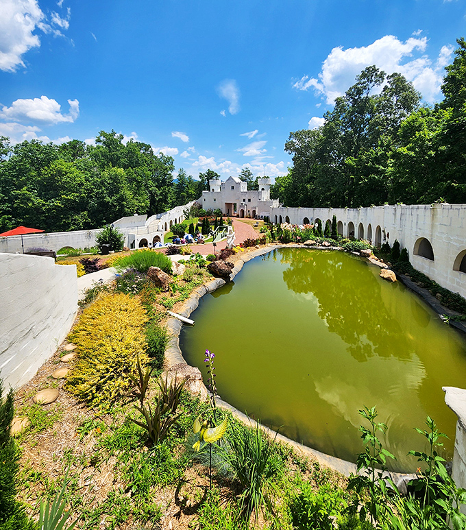 The castle's reflecting pond creates perfect mirror images on still days, doubling the fantasy and making photographers reach for their cameras.