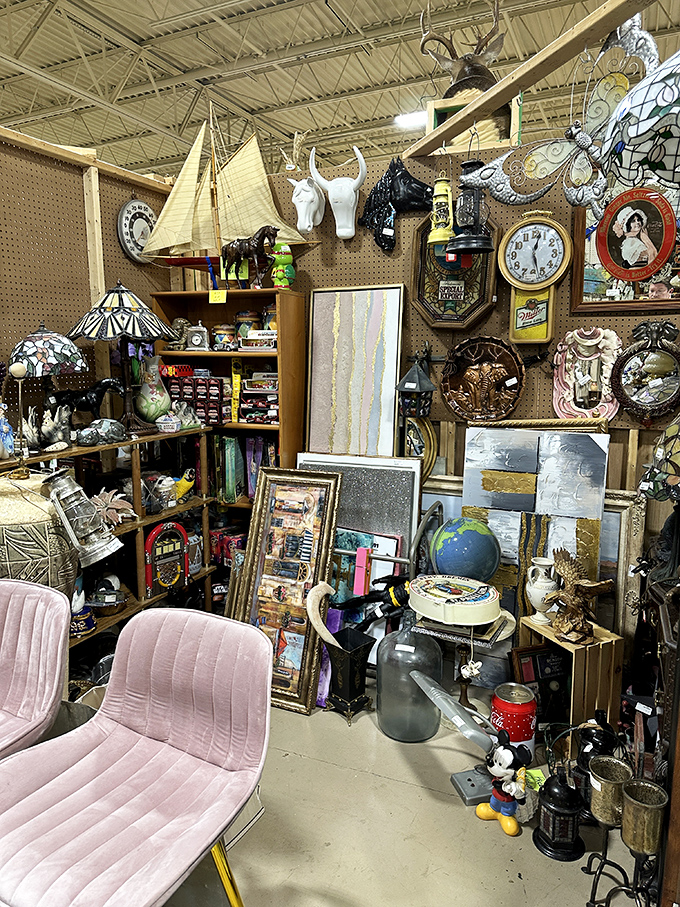 This booth is what happens when maximalism meets nostalgia. Animal heads, vintage clocks, and pink chairs create a delightful visual cacophony of decades past.