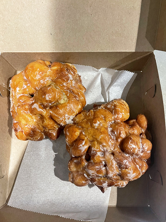 Apple fritters that look like they've been working out. These golden-glazed beauties could win a heavyweight championship in the donut division.