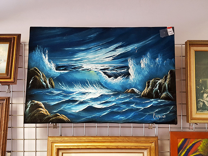 Ocean waves crash dramatically in this thrift store painting &ndash; the kind of conversation piece that makes guests ask, "Where did you find that?"