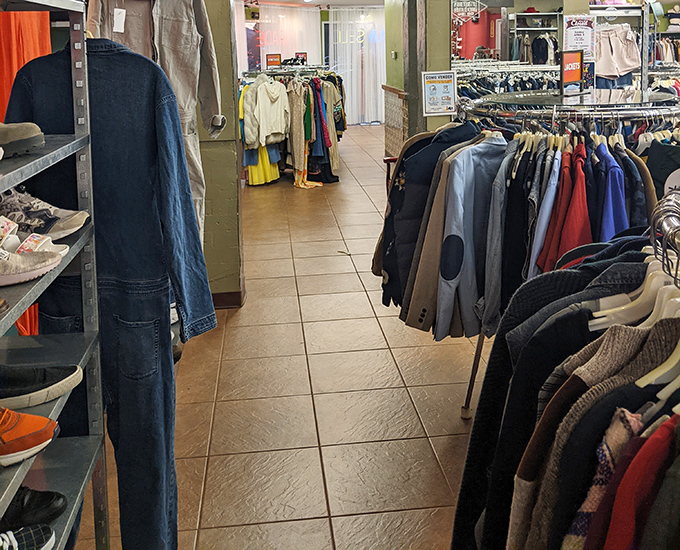 The labyrinth of carefully curated clothing creates fashion canyons to explore, each rack a new opportunity for discovery.