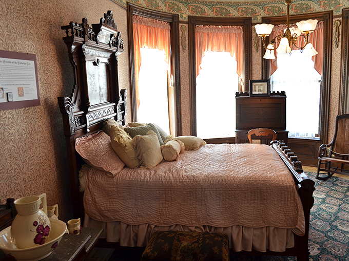 Victorian bedrooms: where comfort meets conversation pieces. That ornate headboard probably cost more than my first car, but who's counting?