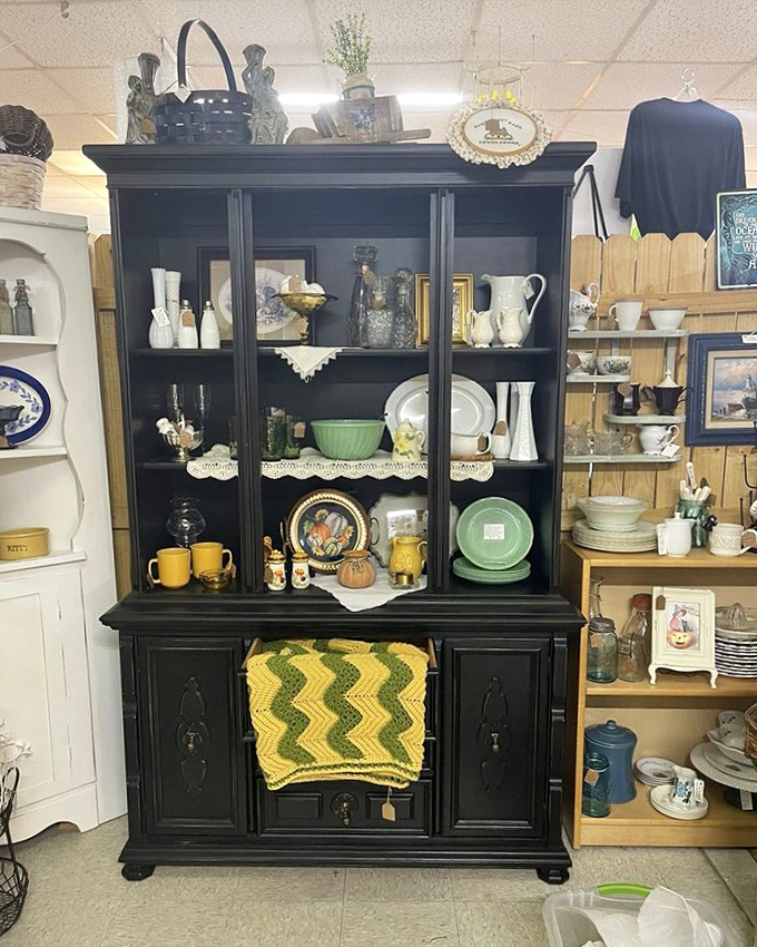 This stately black cabinet doesn't just display dishes &ndash; it showcases domestic history with each carefully arranged teacup and jadeite plate.