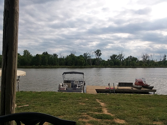 A pontoon boat waits patiently at the dock, ready for adventures on Big Lake's inviting waters. Your floating porch awaits.