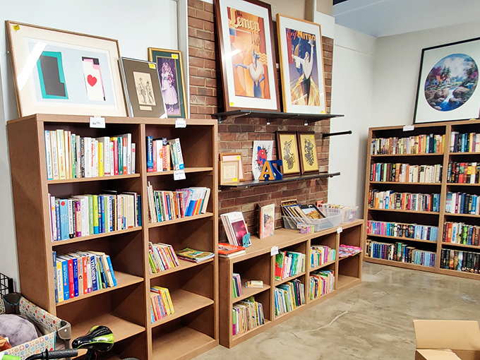 Books and art sharing space like old friends at a reunion. That paperback might have beach sand from three vacations ago hiding in its pages.