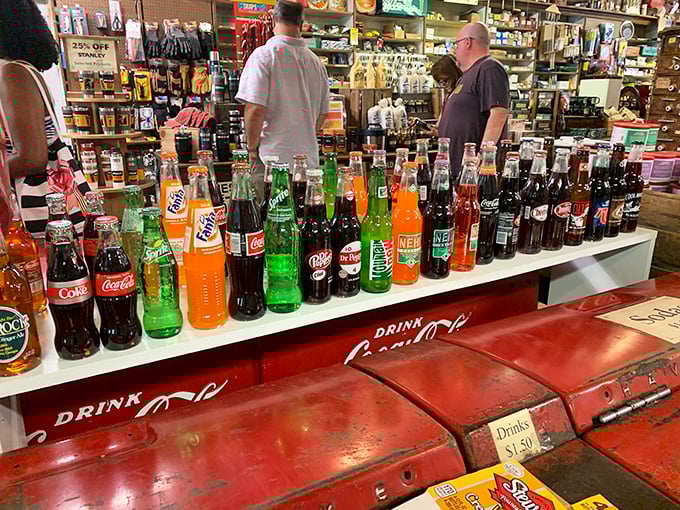 The rainbow lineup of glass-bottled sodas stands at attention like sugary soldiers. That "psssst" sound when opened? That's the official soundtrack of summer.