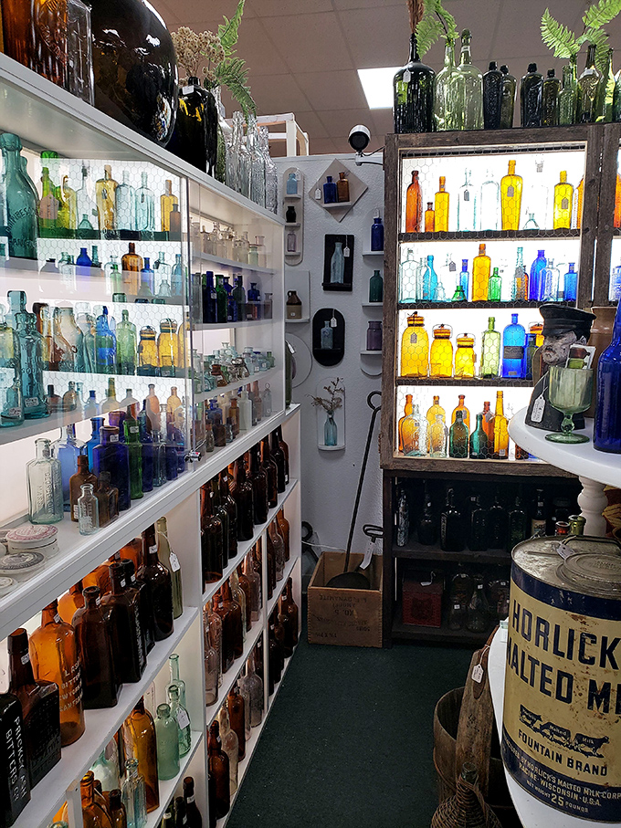 A rainbow of vintage bottles catches the light like liquid jewels&mdash;each one with stories to tell about potions and tonics past.