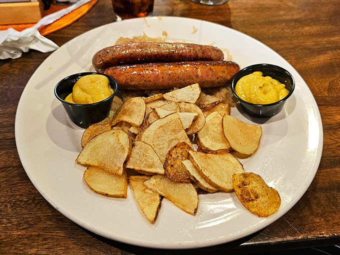 Two plump sausages stand proudly beside golden potato wedges&mdash;a simple yet profound reminder that Germans really understand comfort food.
