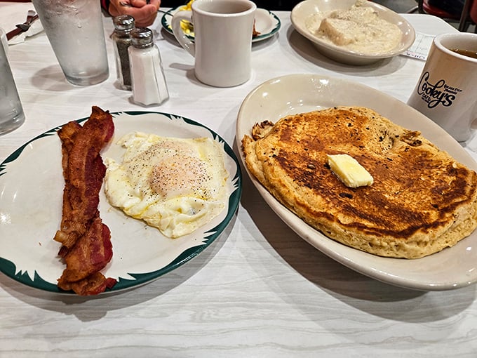 Breakfast perfection: golden pancakes the size of frisbees alongside eggs and bacon that would make even the most committed dieter reconsider their life choices.