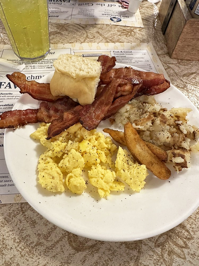 Breakfast of champions! Fluffy scrambled eggs, perfectly crisped bacon, and home fries that make you question why you ever eat anything else in the morning.