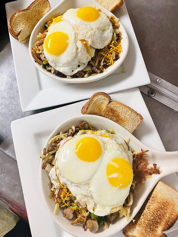 Breakfast skillets that could convert a morning-hater into a dawn enthusiast, crowned with perfectly cooked eggs like edible sunshine.