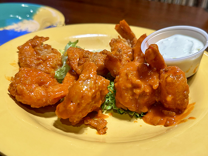 Buffalo shrimp that glow like tiny orange beacons of deliciousness. These saucy little flavor bombs prove that buffalo sauce isn't just for chicken wings anymore.