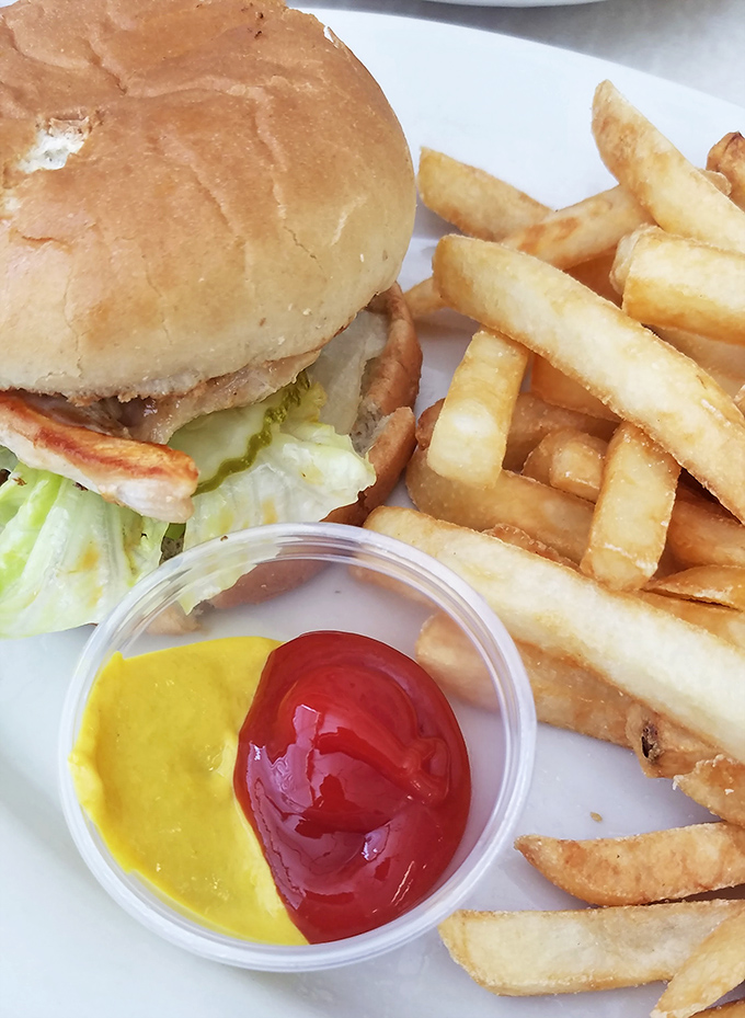 This isn't some fancy gastropub's "deconstructed" burger&mdash;it's the real deal, with crispy fries and that perfect half-and-half condiment setup that says "we get you."