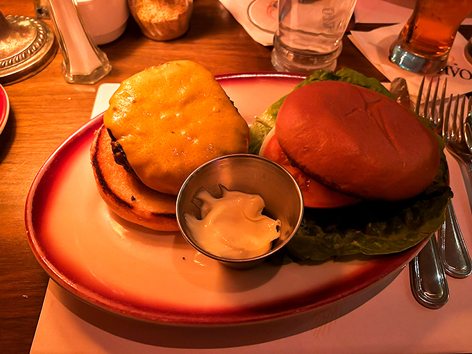 These aren't just burgers; they're hand-crafted beef symphonies on freshly baked buns. The sauce cup isn't optional&mdash;it's essential supporting cast.