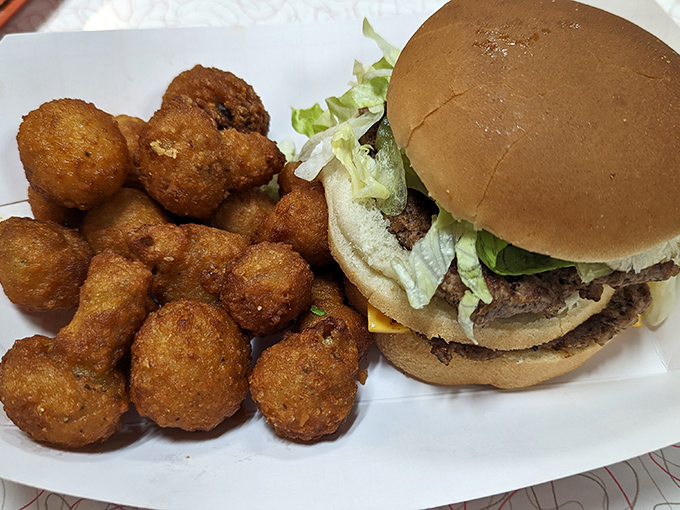 This isn't some fancy gastropub's deconstructed interpretation&mdash;it's an honest-to-goodness burger with those magical little mushroom-shaped onion nuggets that deserve their own fan club. 