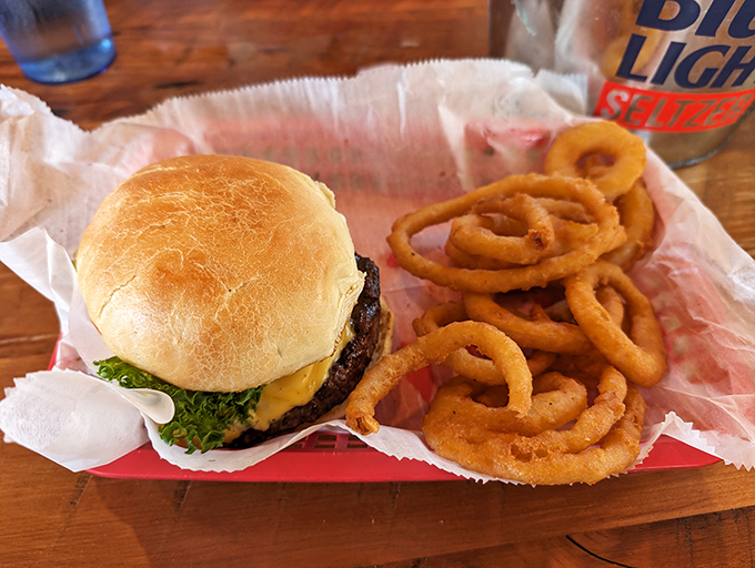 A proper tavern burger doesn't need truffle aioli or artisanal brioche&mdash;just quality beef, melty cheese, and those onion rings that shatter with each glorious bite.